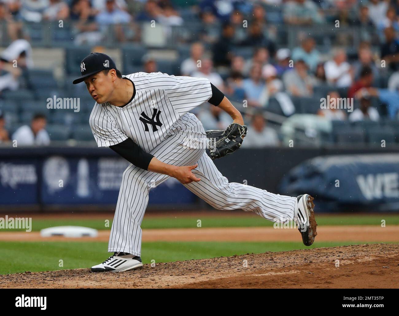 New York Yankees starting pitcher Masahiro Tanaka delivers against the ...