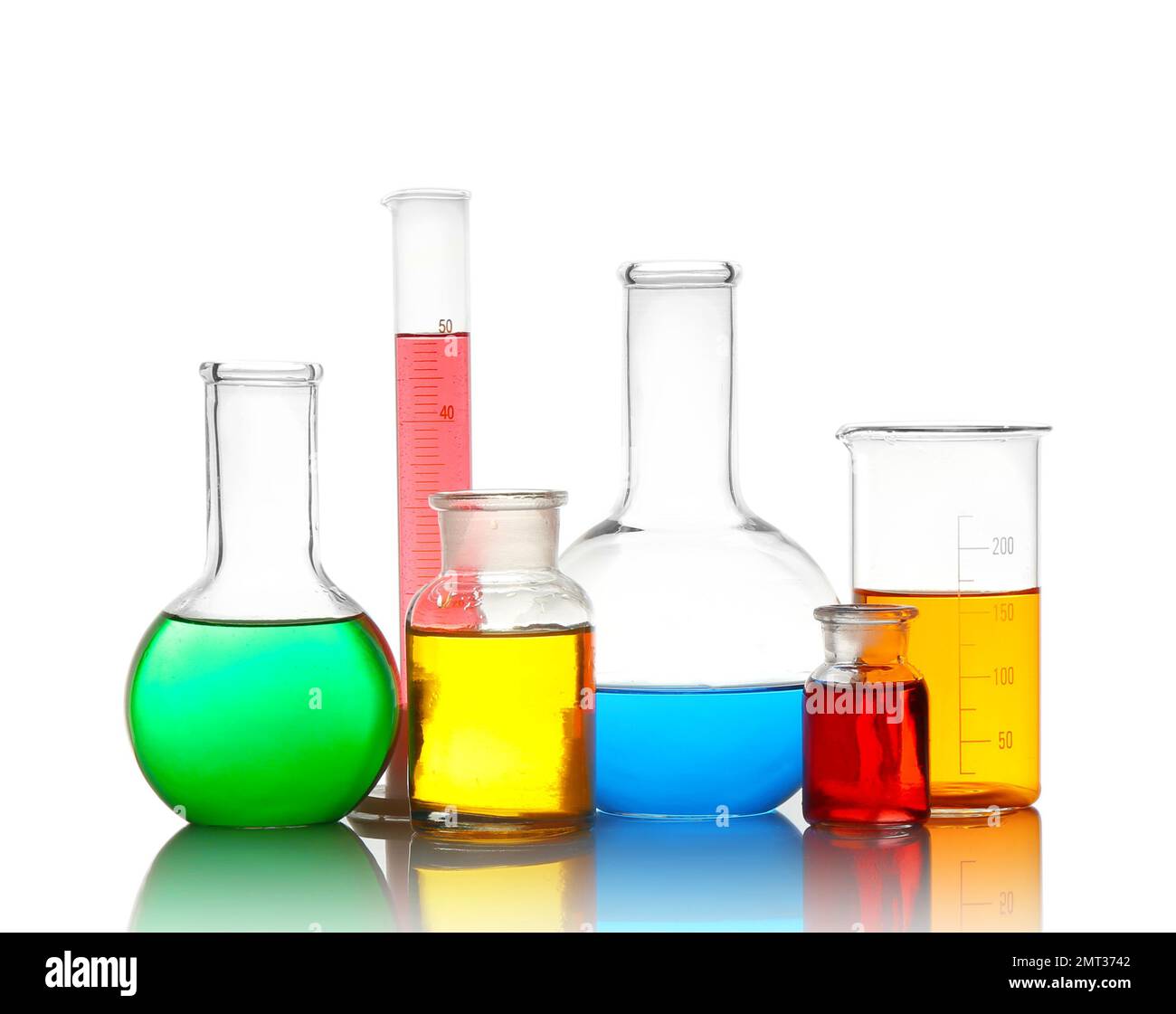 Different laboratory glassware with colorful liquids isolated on white ...
