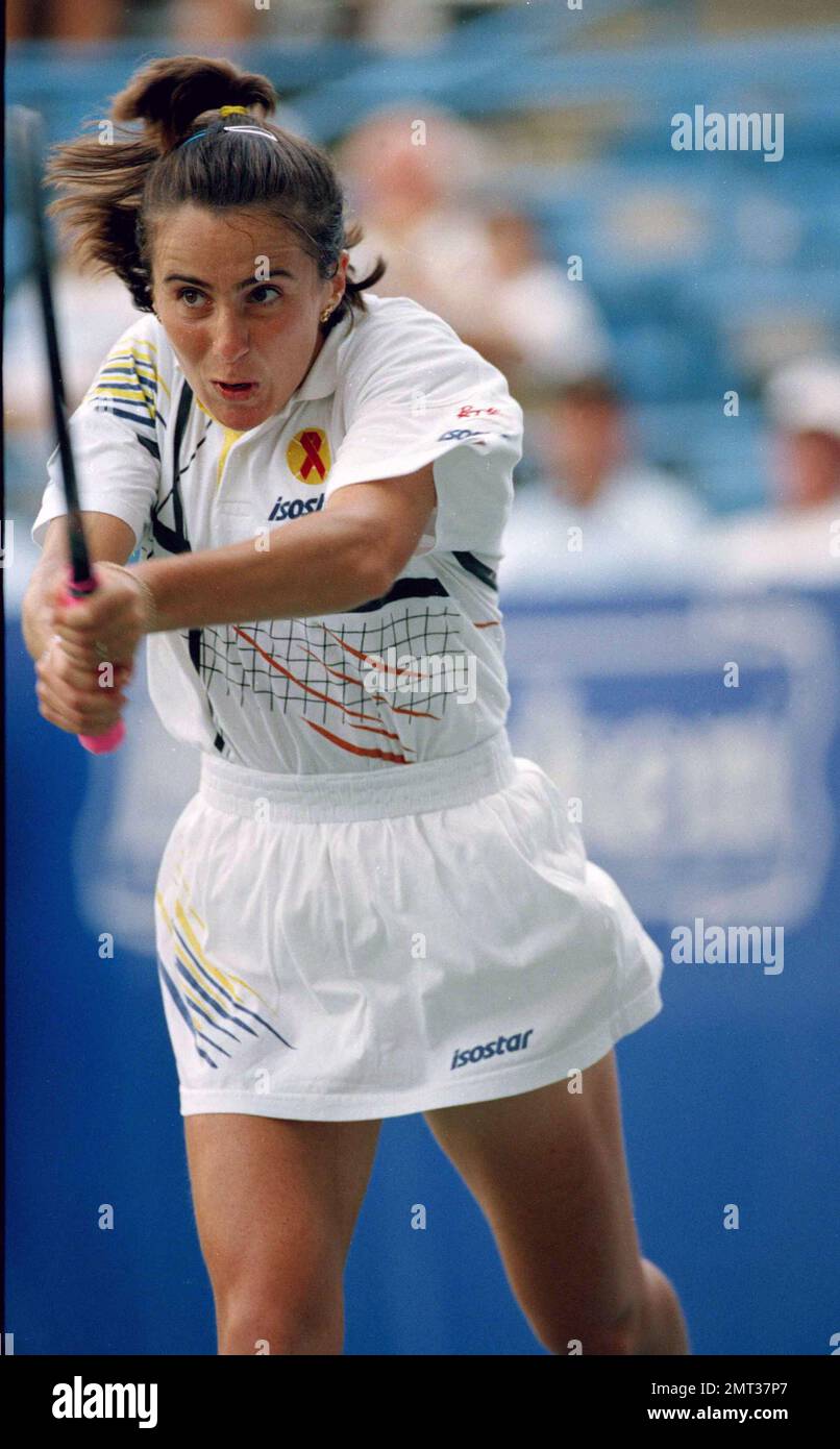 Katerina Maleeva of Bulgaria returns the ball to her sister Magdalena ...