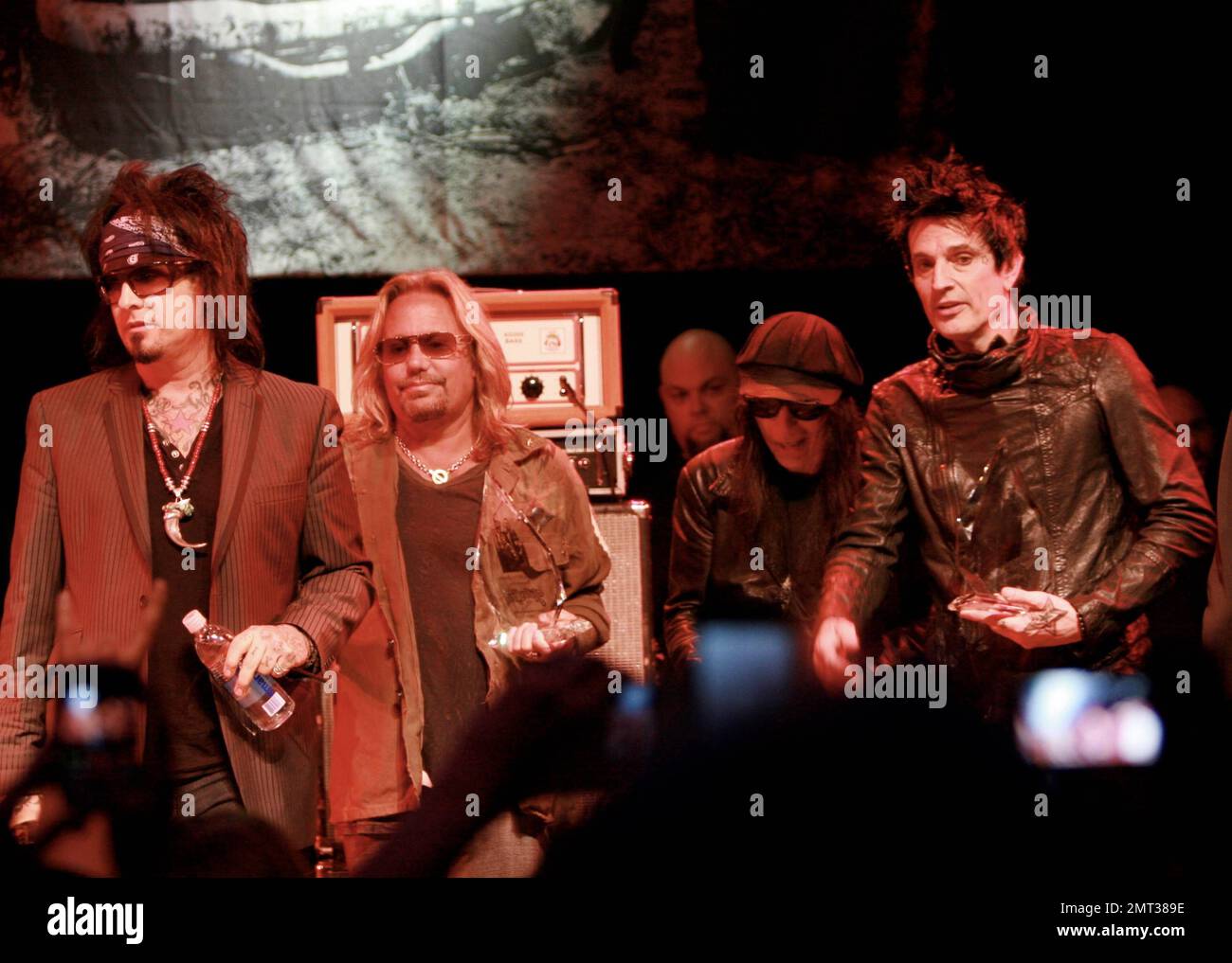 Bassist Nikki Sixx, vocalist Vince Neil, guitarist Mick Mars and ...