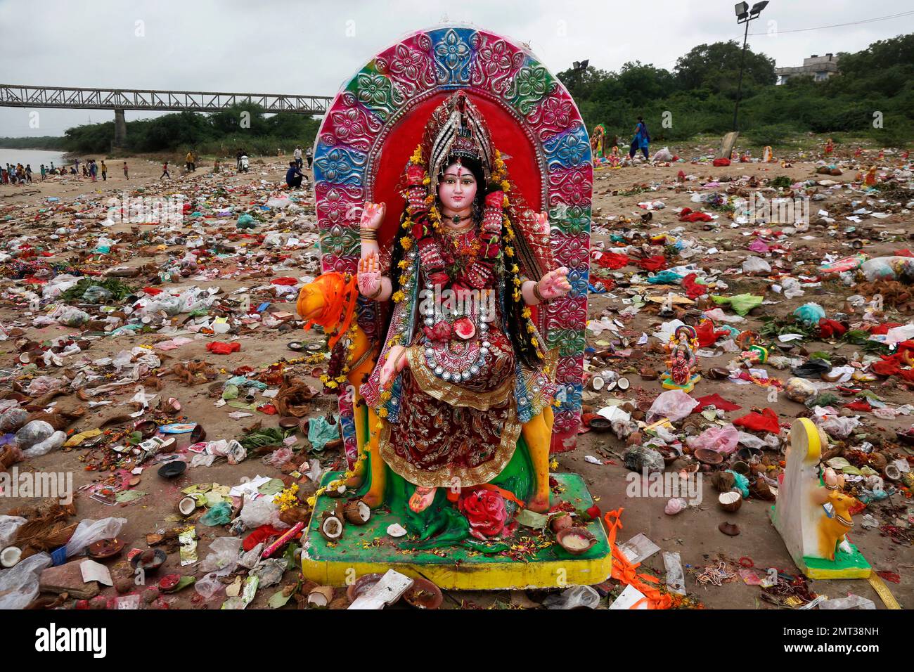 An idol of Hindu goddess Dashama stands among offerings and worship ...