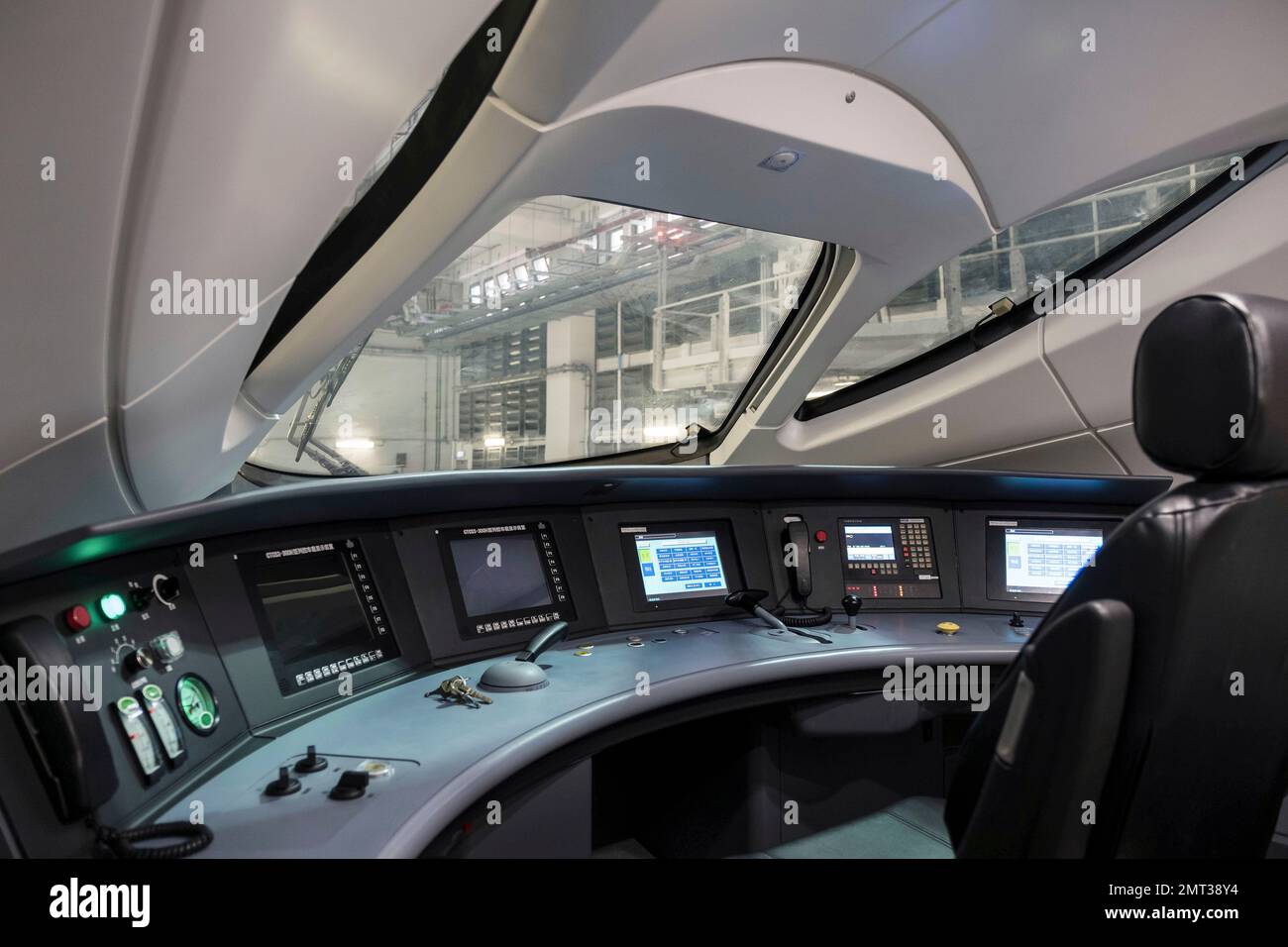Control panels line the desk in the control room of a Guangzhou ...