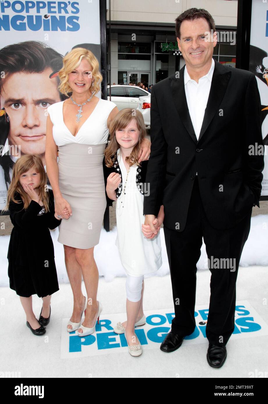 Dina Waters, Director Mark Waters, and children arrive at the premiere ...