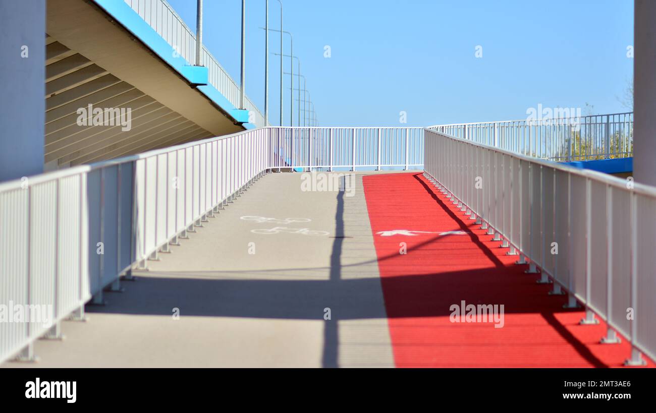 Bicycle path and sidewalk through the highway bridge Stock Photo - Alamy