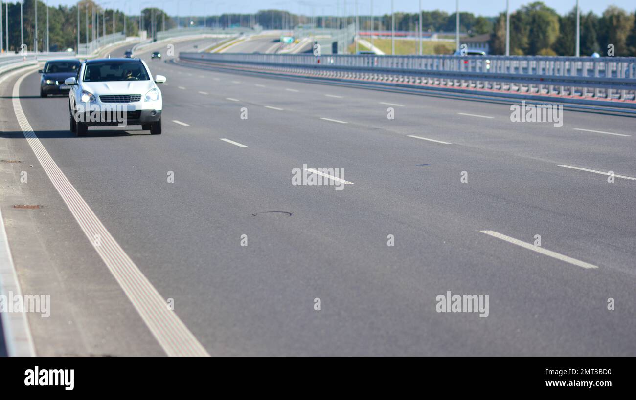 View on a concrete highway. Modern highway safety markings on concrete ...