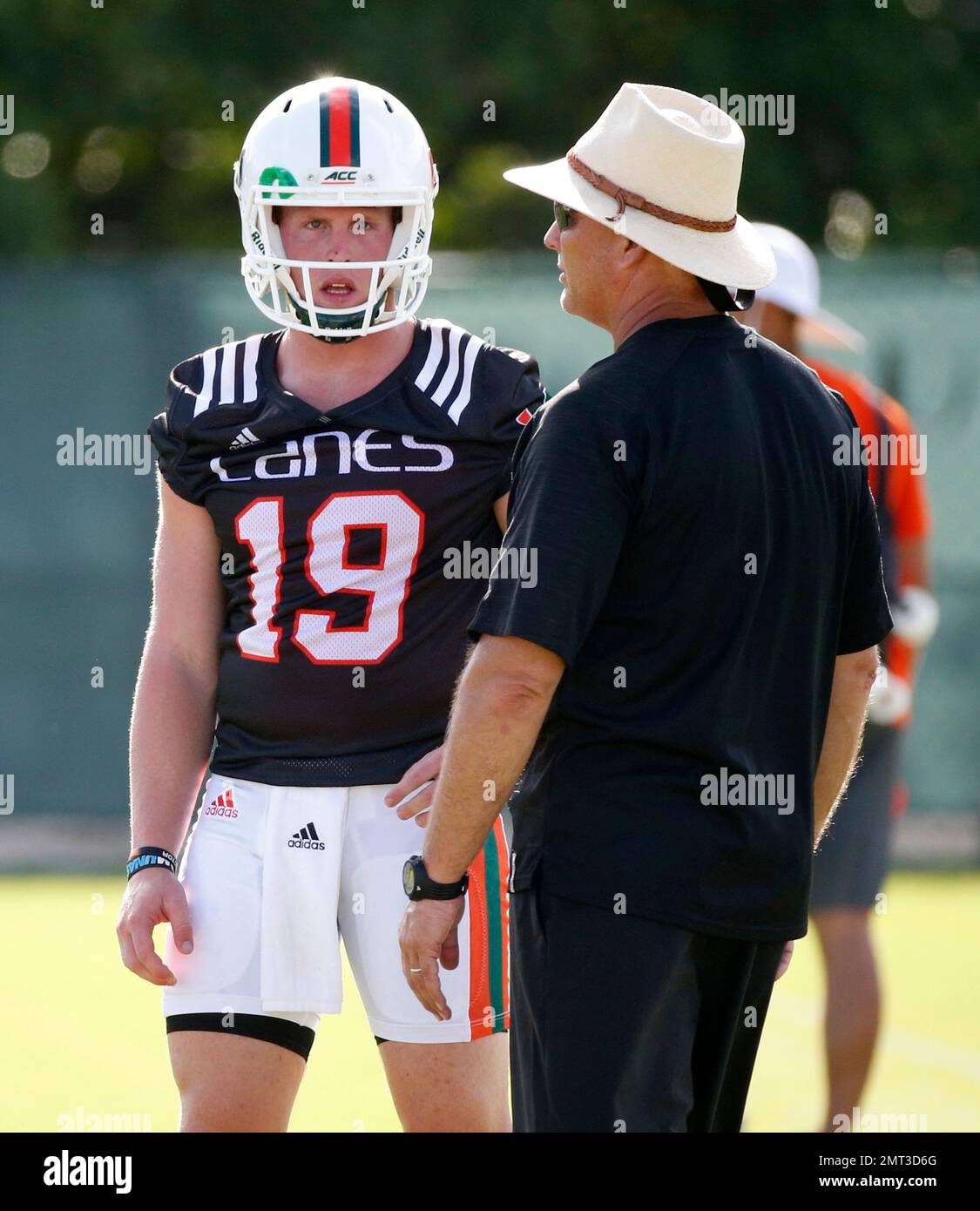 Miami head coach Mark Richt, right, talks with quarterback Augie ...