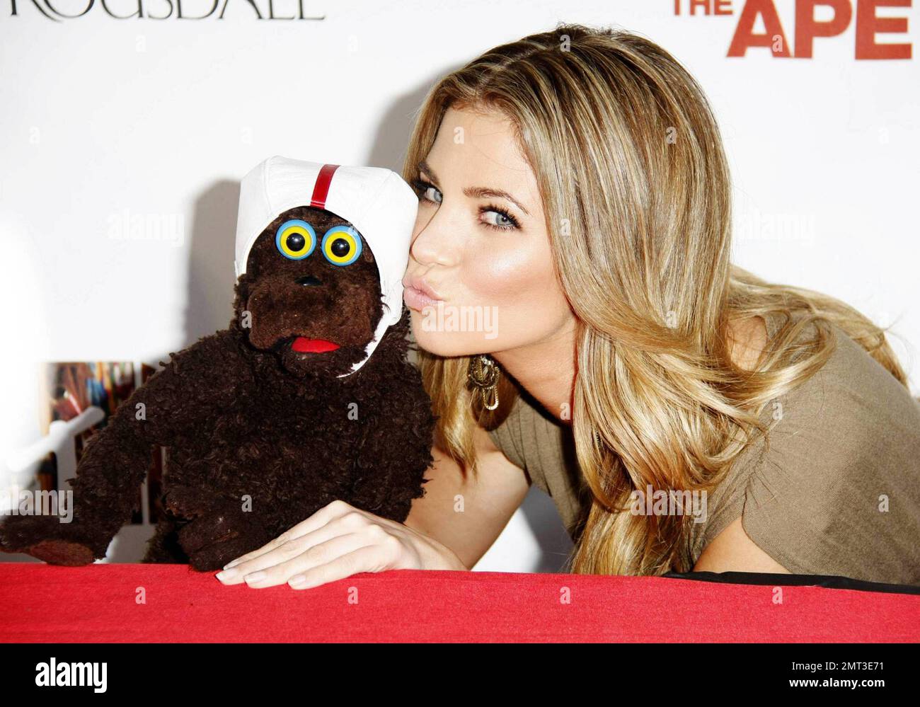 Amber Lancaster poses with Warren the Ape puppet at the launch party ...