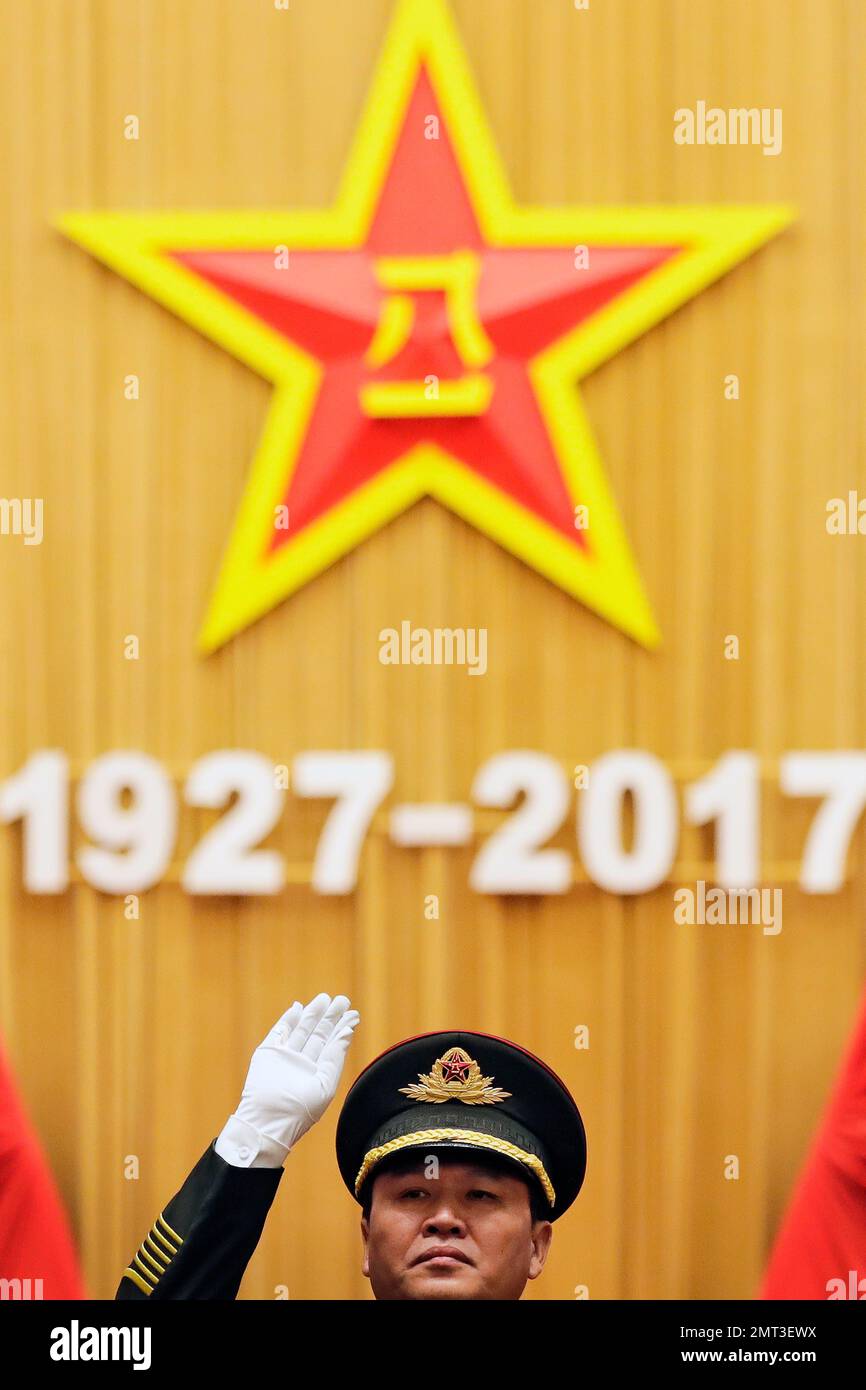 A military band conductor rehearses ahead of a ceremony to commemorate ...