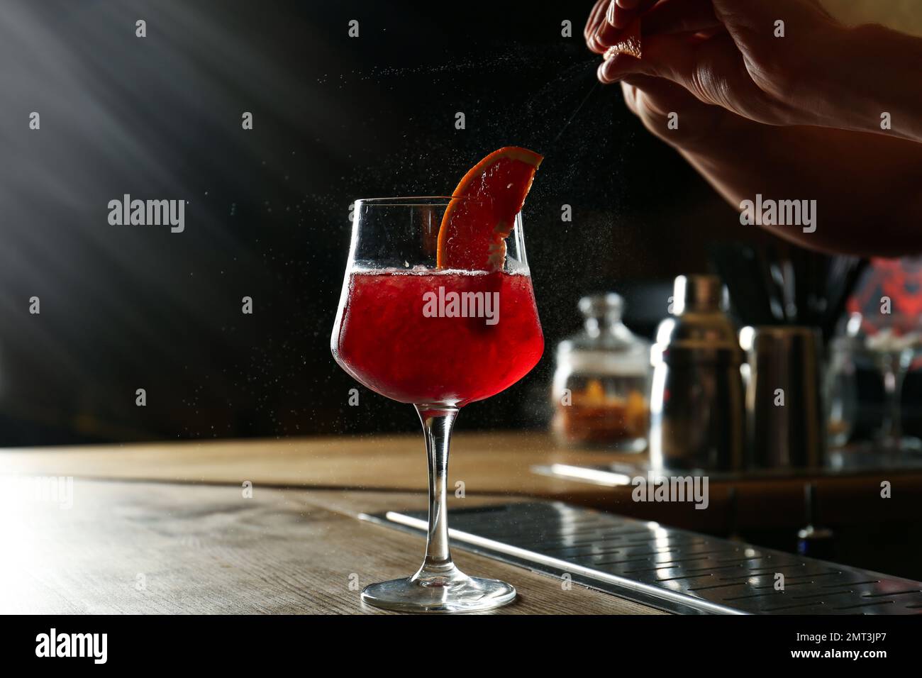 Bartender preparing fresh alcoholic cocktail at bar counter, closeup ...