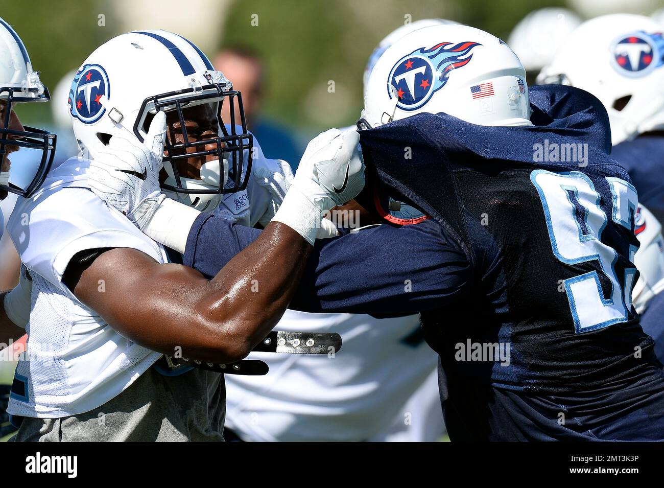 Tennessee Titans tight end Jonnu Smith, left, blocks outside linebacker ...