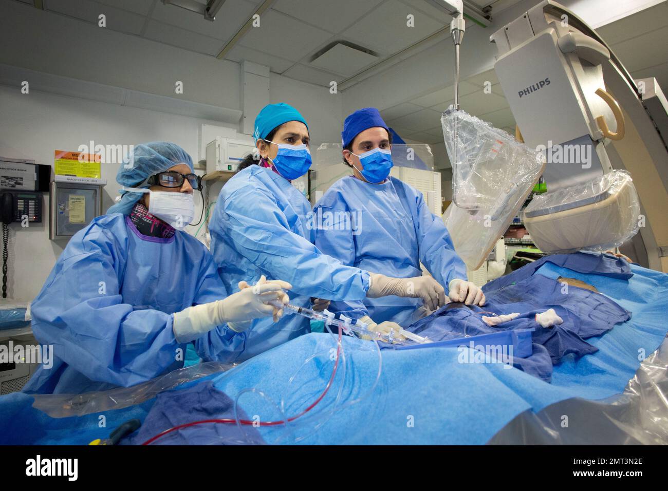 In this Feb. 16, 2017 photo, Dr. Annapoorna Kini, center, performs a ...
