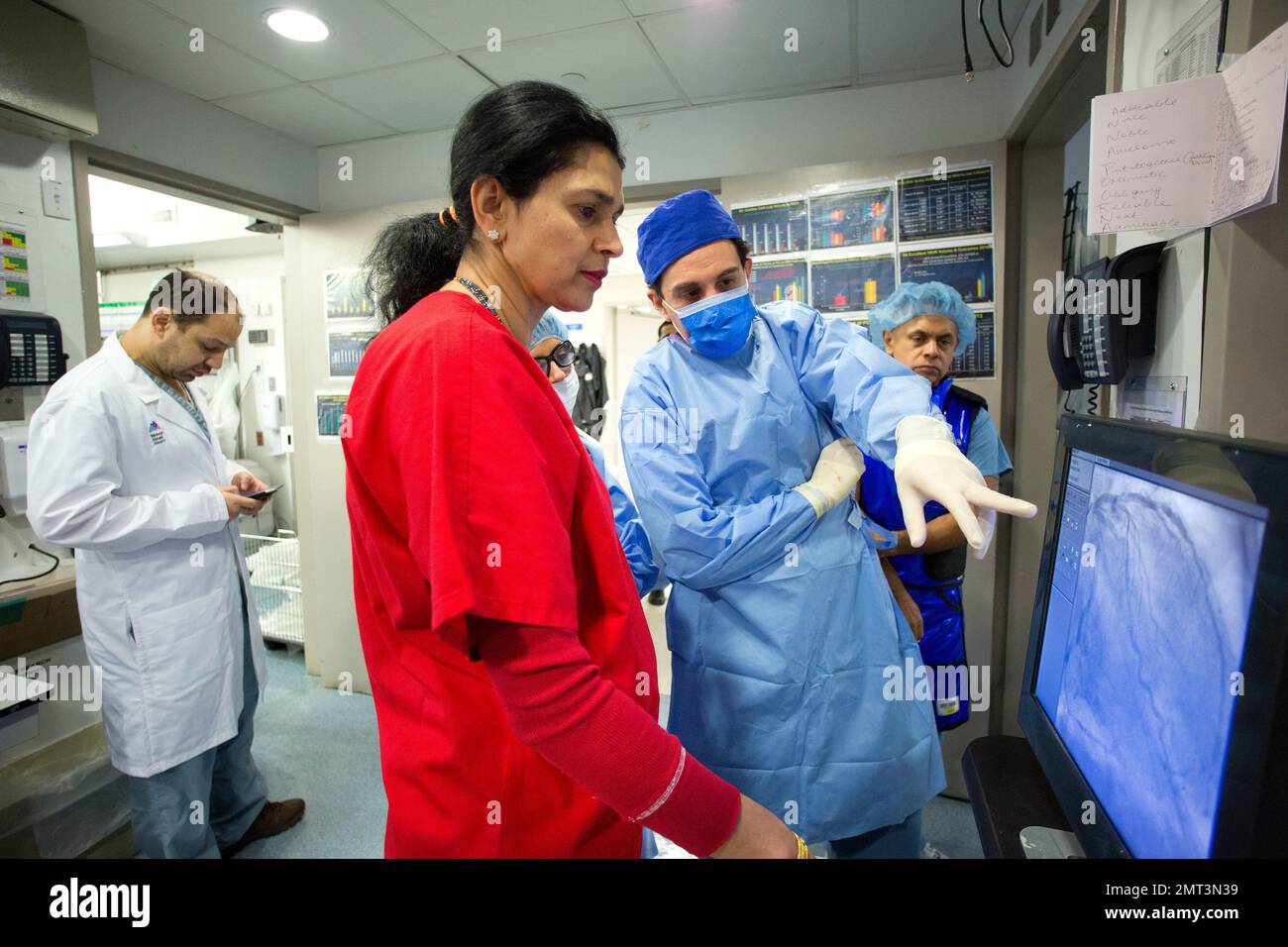 In this Feb. 16, 2017 photo, Dr. Annapoorna Kini, center, reviews a ...