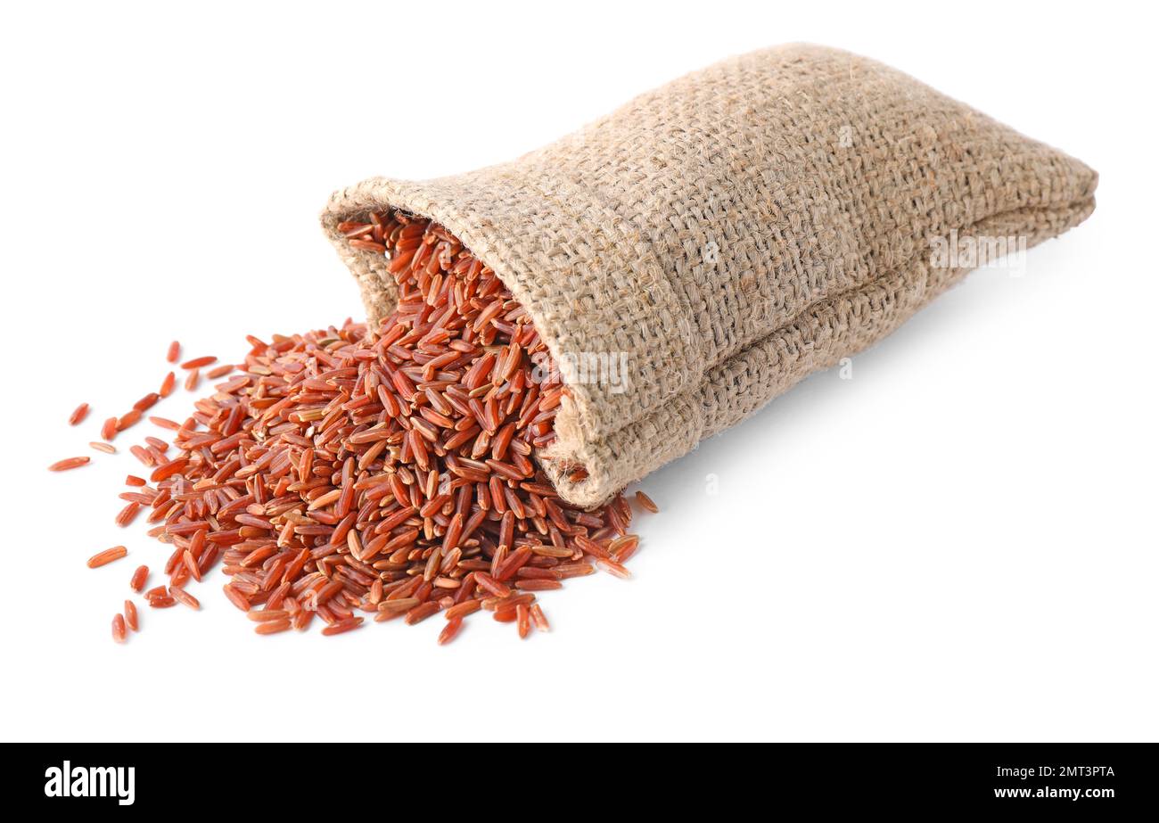 Overturned bag of brown rice isolated on white Stock Photo - Alamy