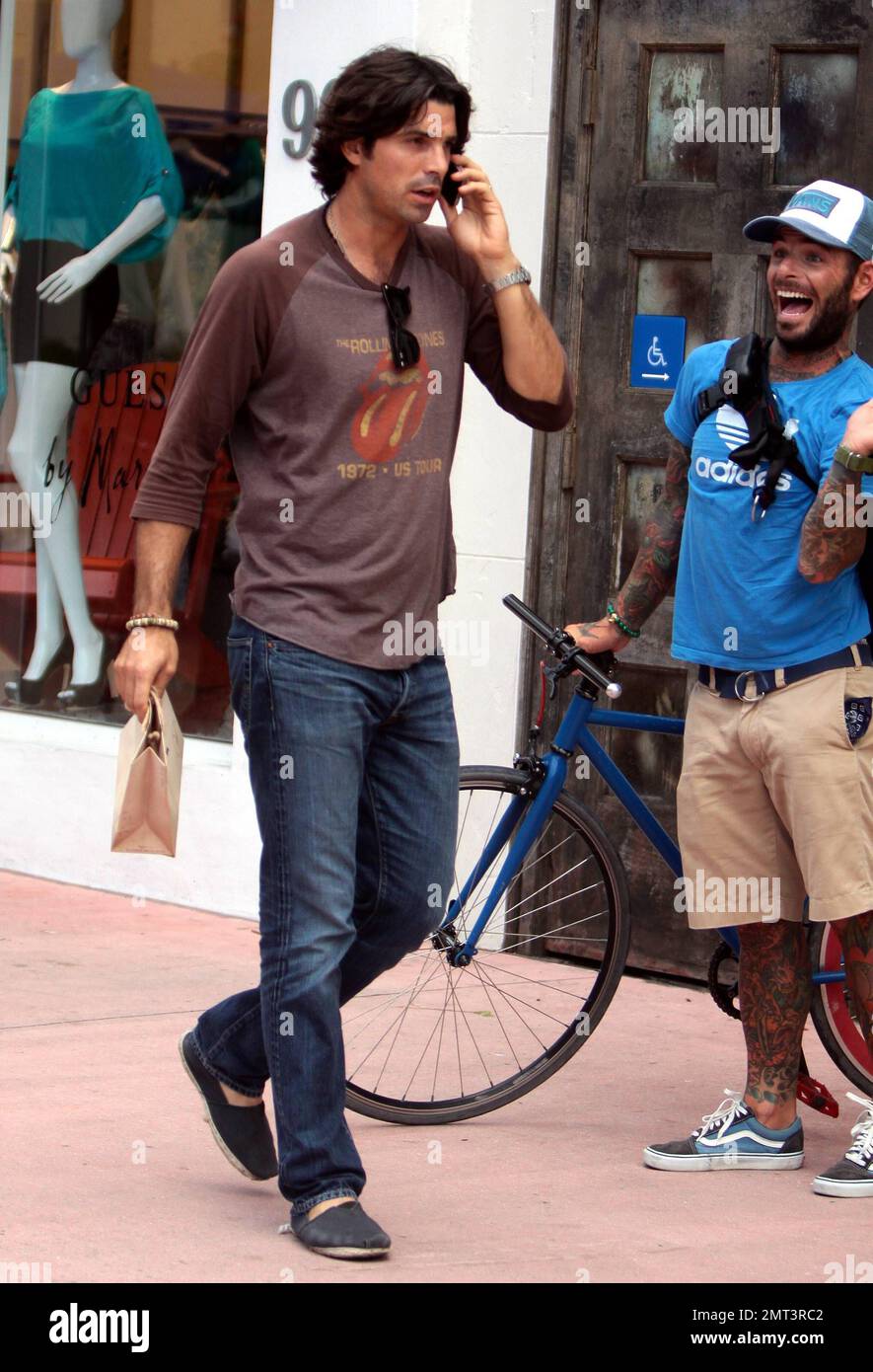 Argentine polo player Ignacio "Nacho" Figueras chats on his cellphone ...