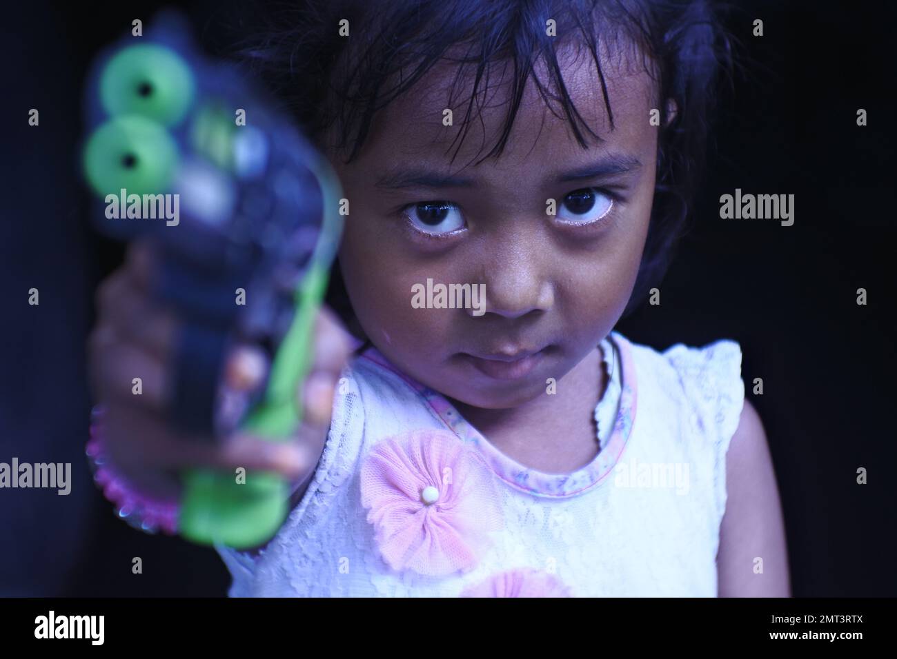 Girl pointing gun hi-res stock photography and images - Alamy