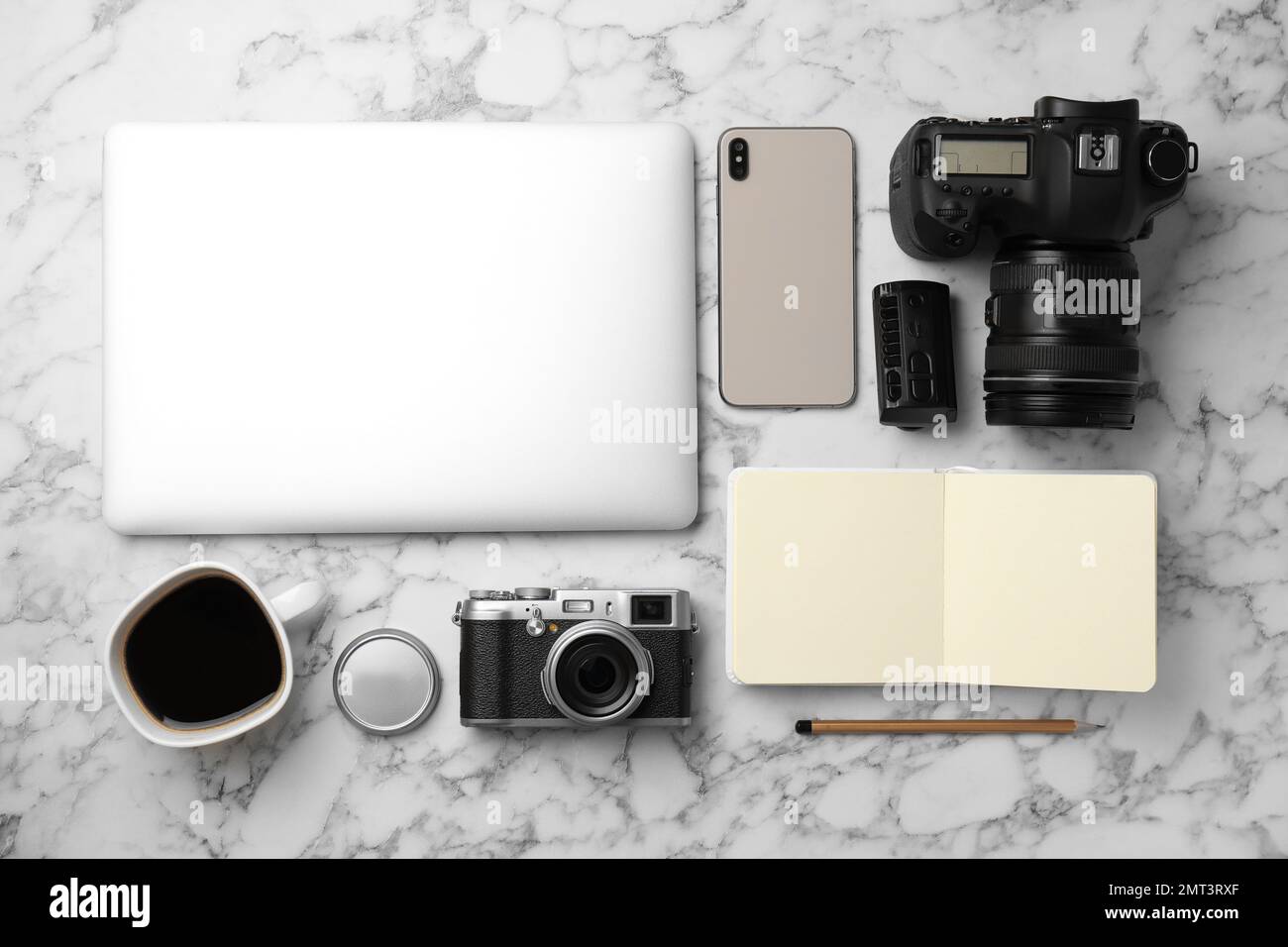 Flat lay composition with laptop, cameras and smartphone on white ...