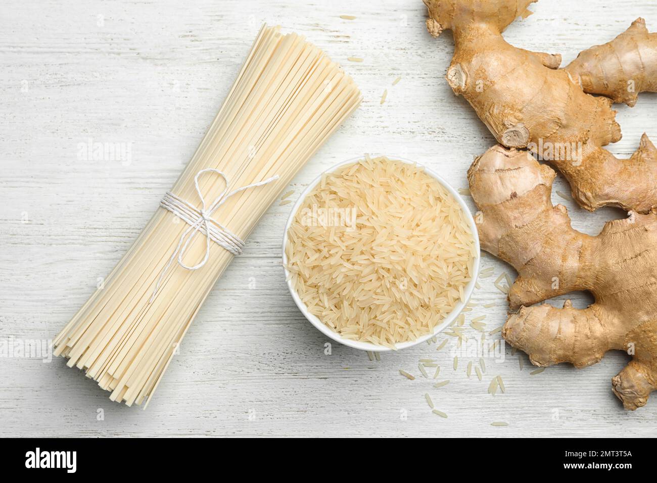 Flat lay composition with rice noodles on white wooden table Stock ...