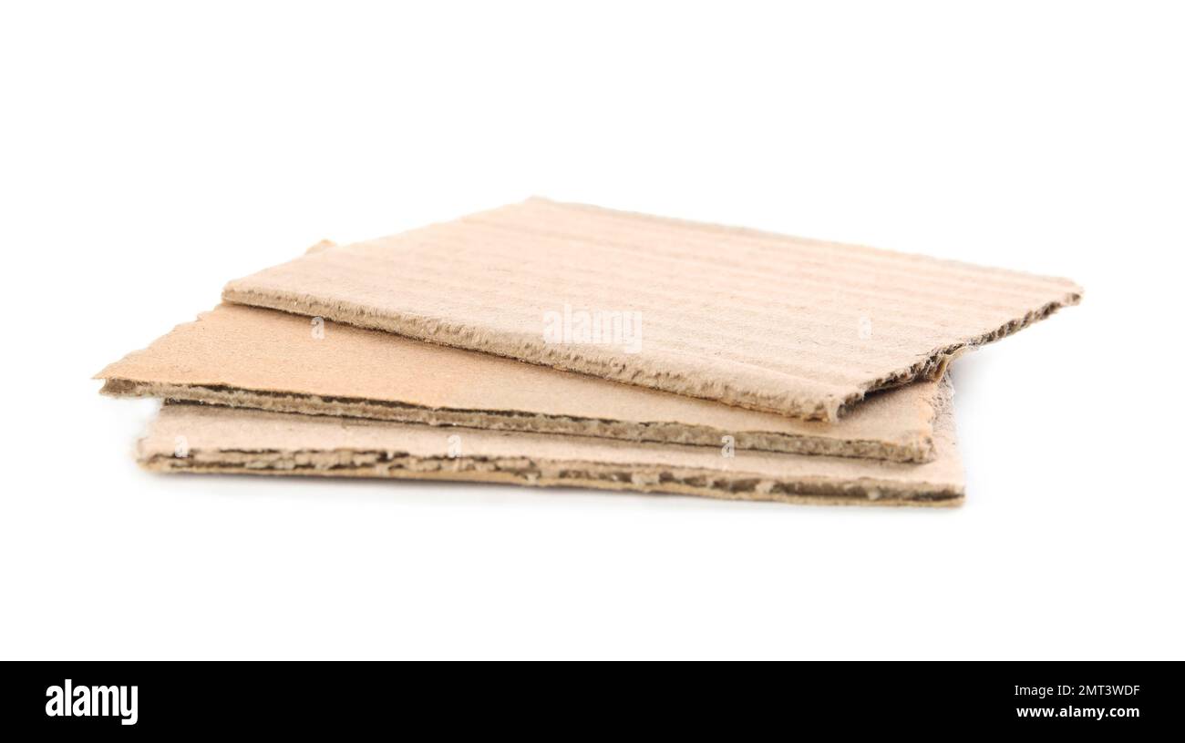 Pieces of brown cardboard isolated on white Stock Photo - Alamy
