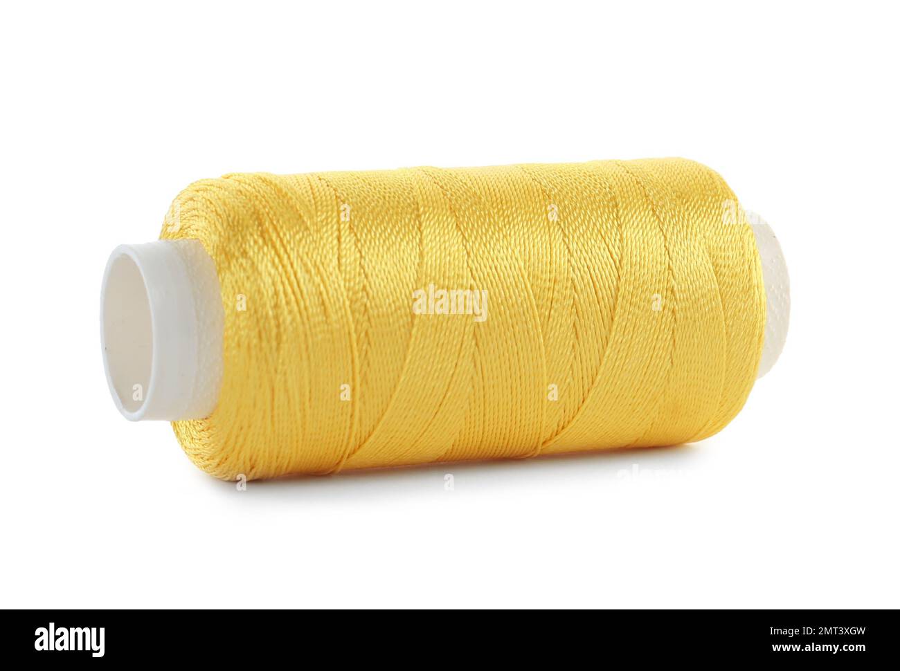 Spool of yellow sewing thread isolated on white Stock Photo - Alamy
