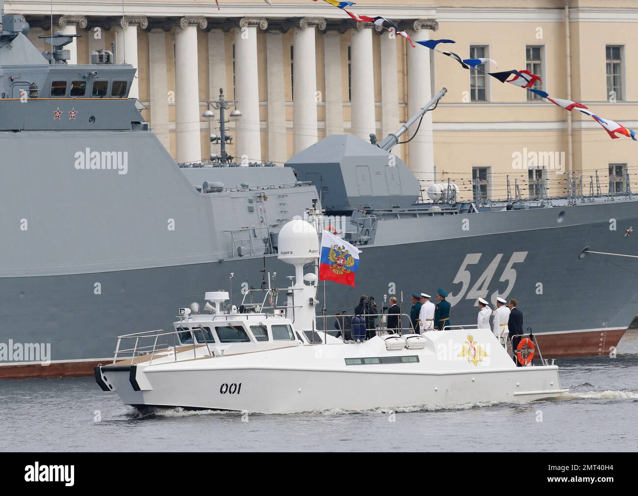 Russian President Vladimir Putin, 3rd left bottom row, greets the crew ...