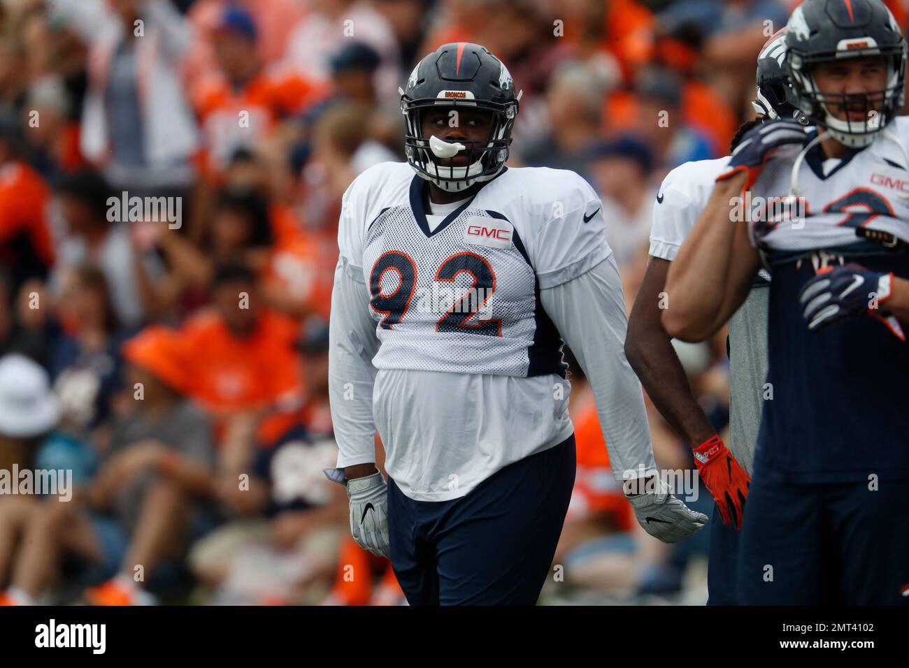 Denver Broncos nose tackle Zach Kerr (92) takes part in drills at an ...