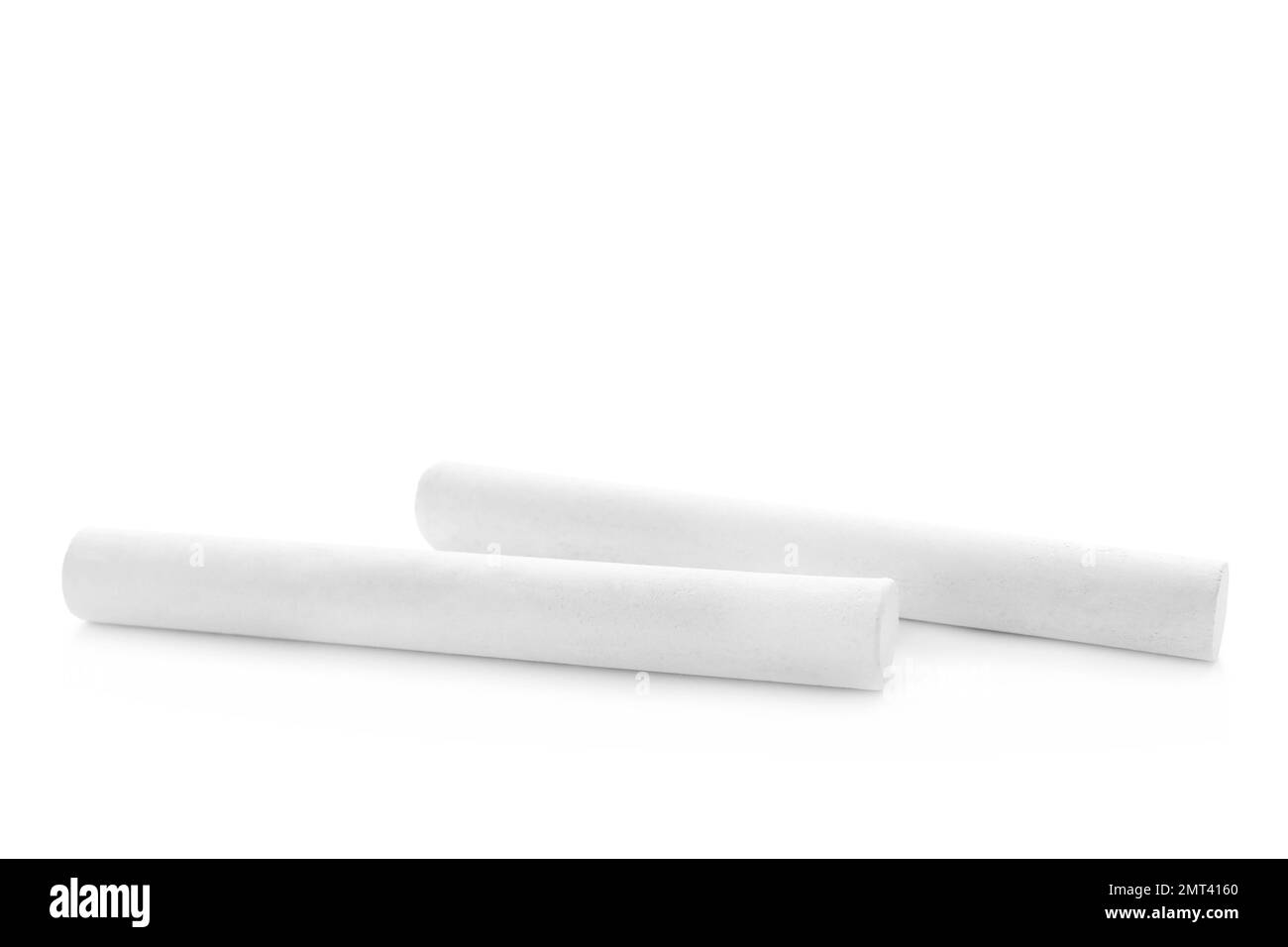 Small pieces of chalk on white background Stock Photo - Alamy