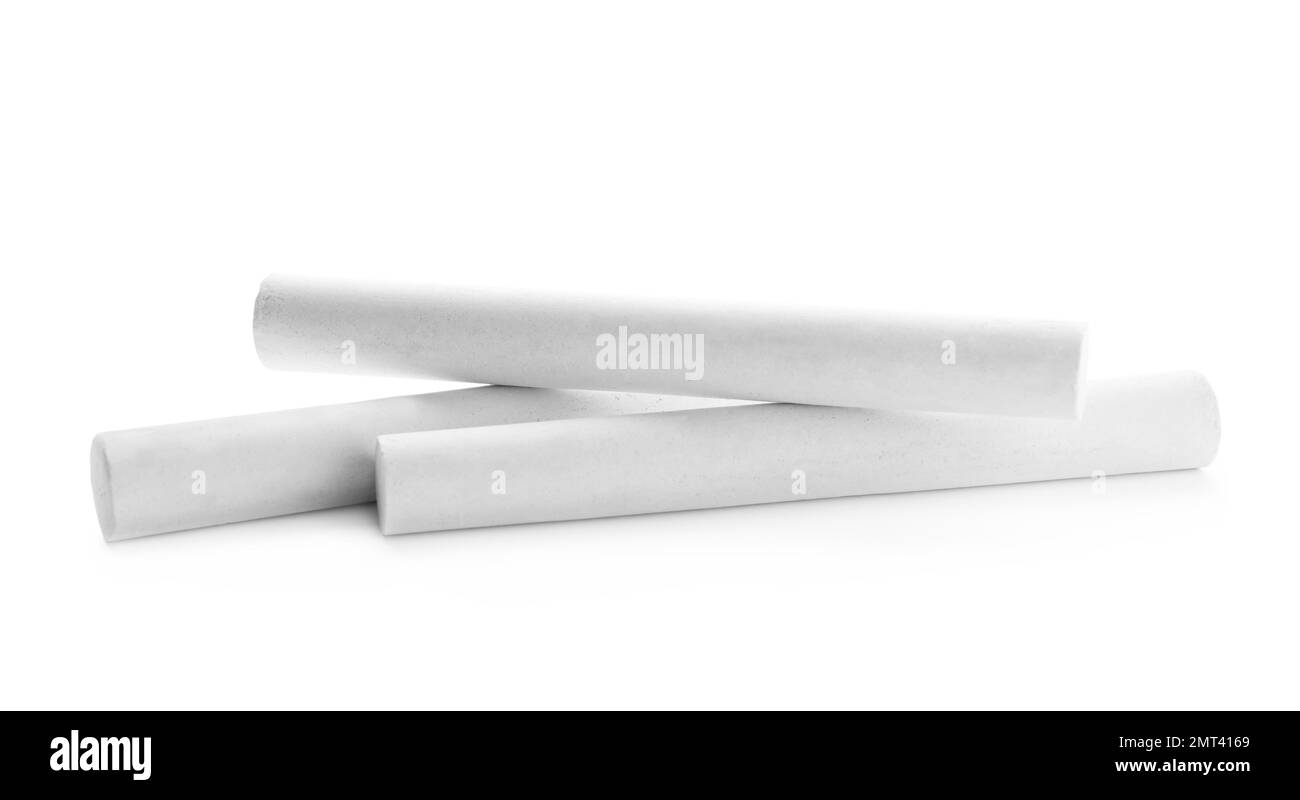 Small pieces of chalk on white background Stock Photo - Alamy