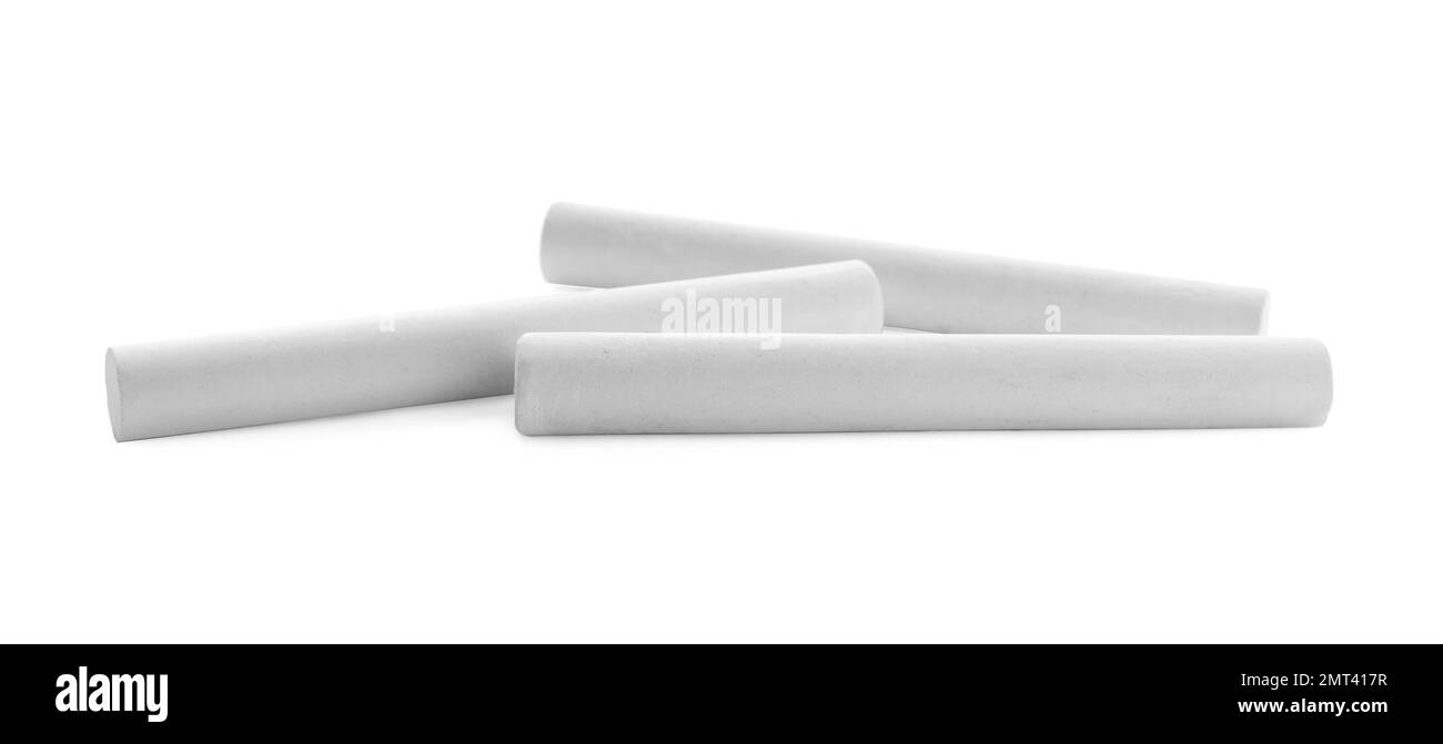Small pieces of chalk on white background Stock Photo - Alamy