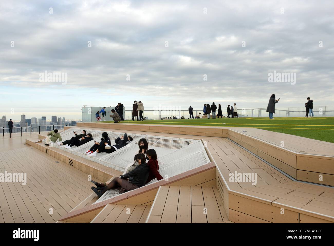 Tourist enjoying the views from the Shibuya Sky roof on top of the ...