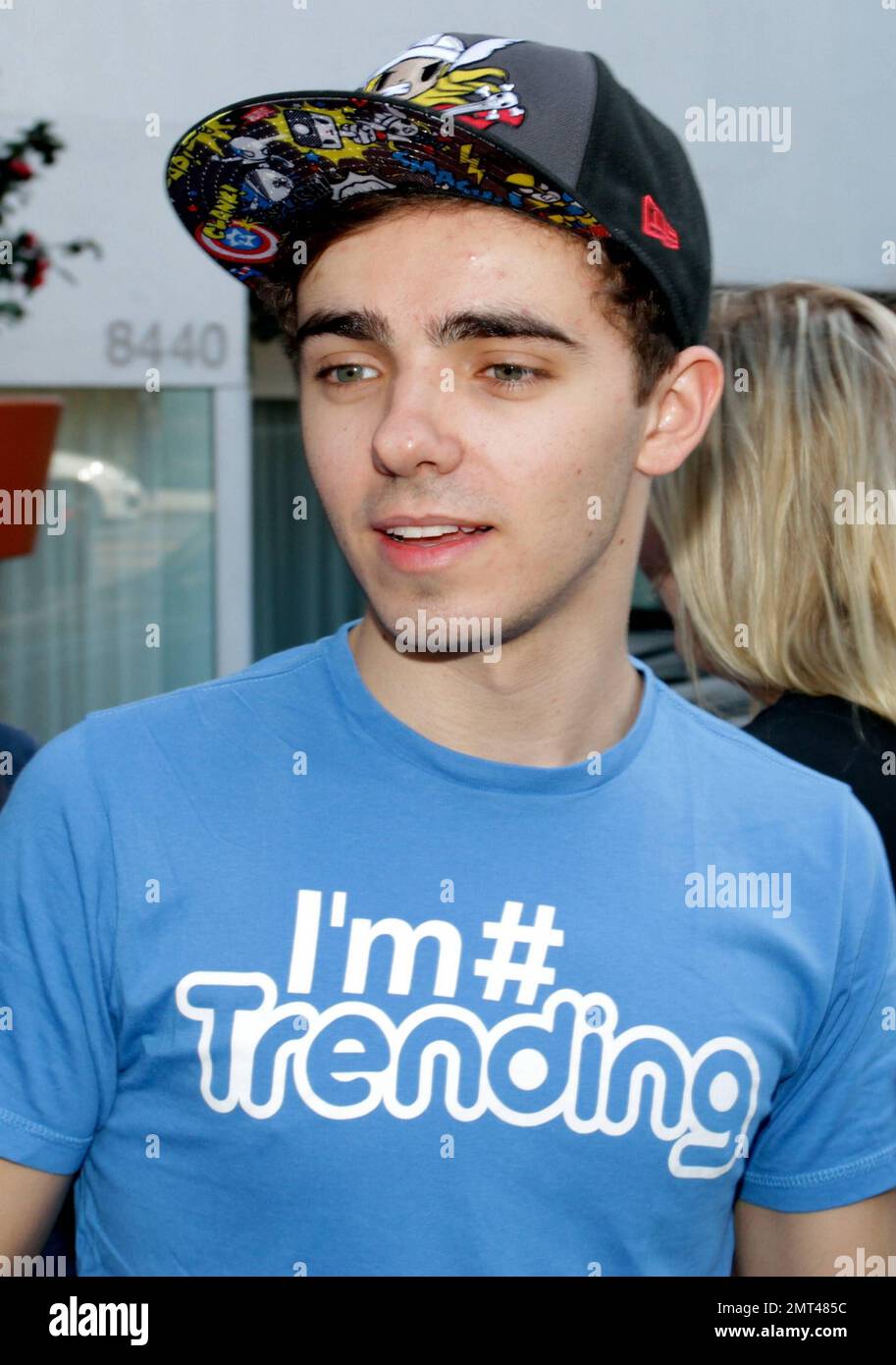 Nathan Sykes of the boy band The Wanted greets fans as he leaves his ...
