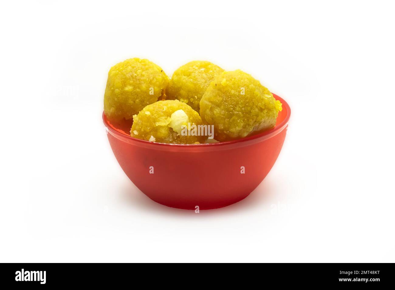 A red bowl of Indian traditional sweets isolated on the white ...