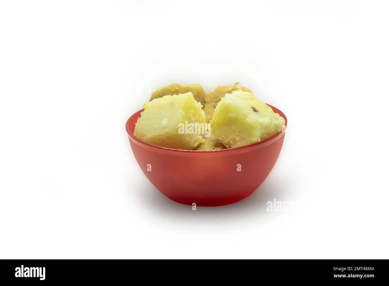 A red bowl of Indian traditional sweets isolated on the white ...