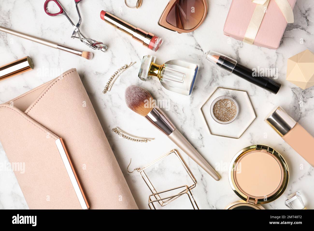 Flat lay composition with different luxury makeup products and ...