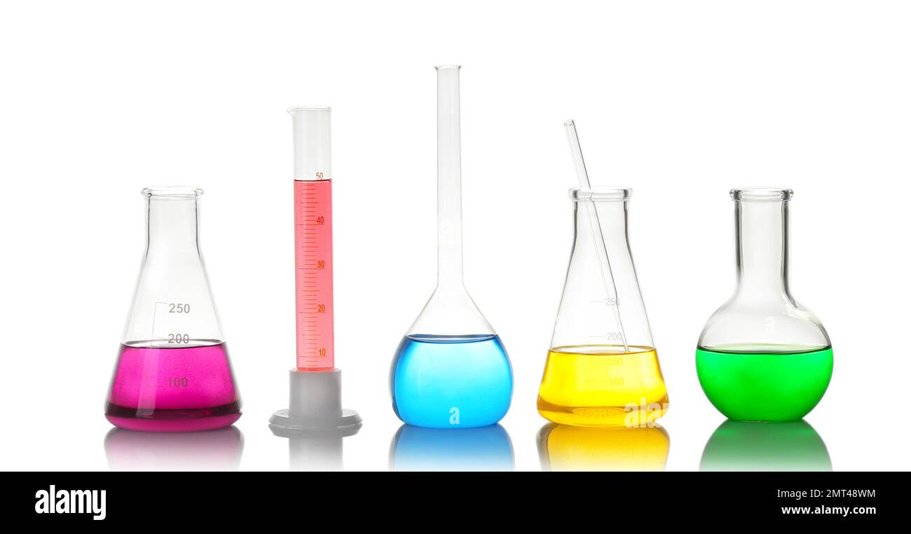 Different laboratory glassware with colorful liquids isolated on white ...