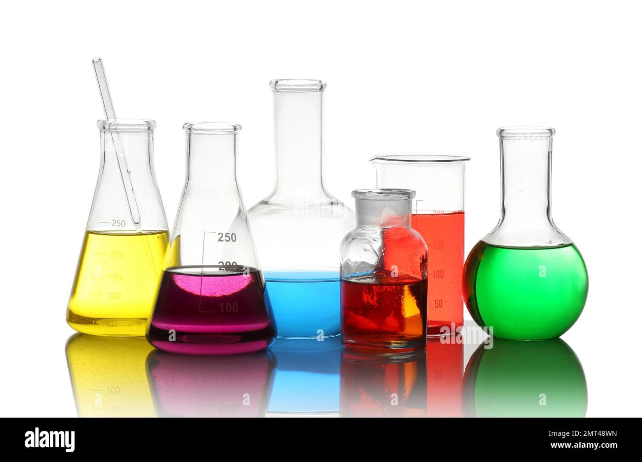 Different laboratory glassware with colorful liquids isolated on white ...