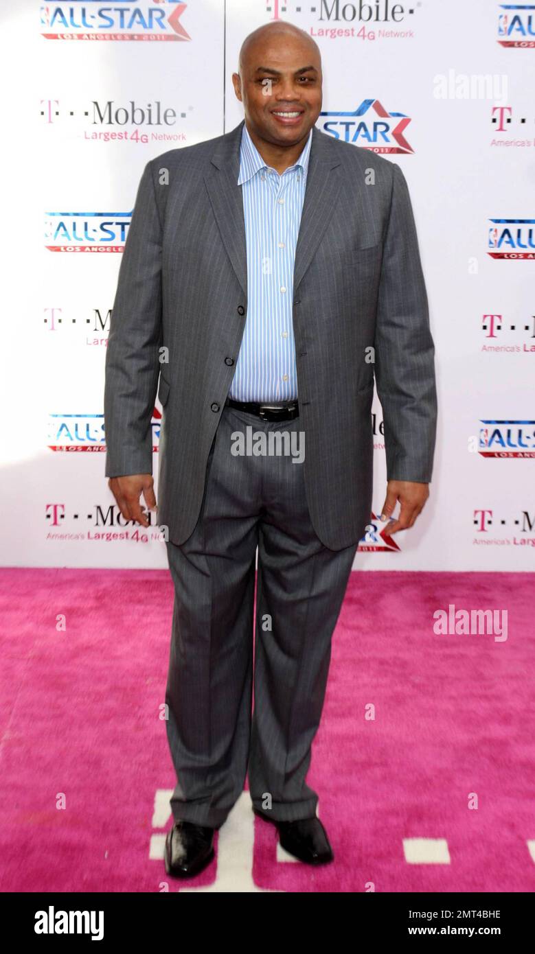 Former NBA player Charles Barkley poses for photographers on the pink ...