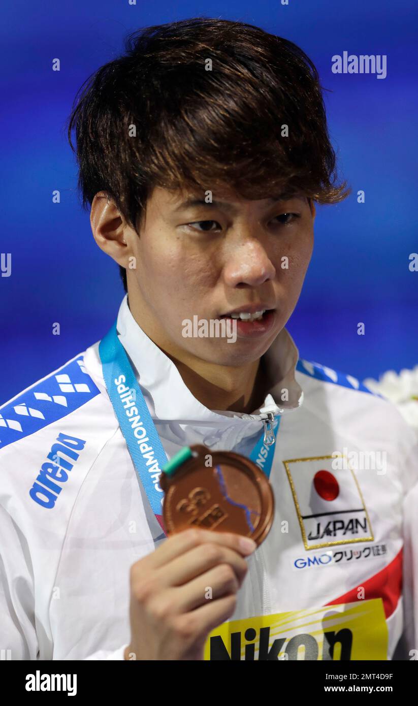 Japan's bronze medal winner Ippei Watanabe shows off his medal after ...