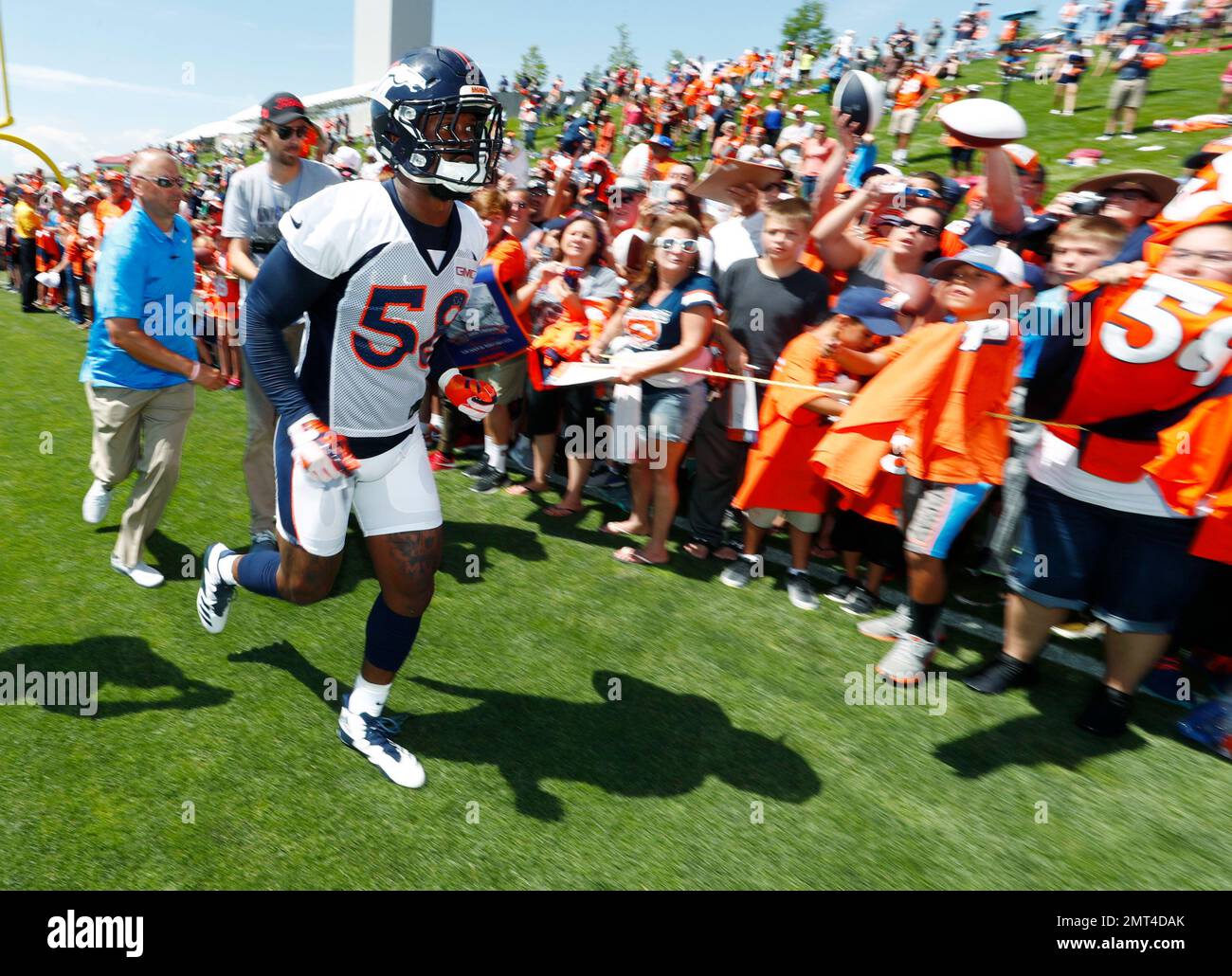 Denver Broncos outside linebacker Von Miller runs past fans as they ...