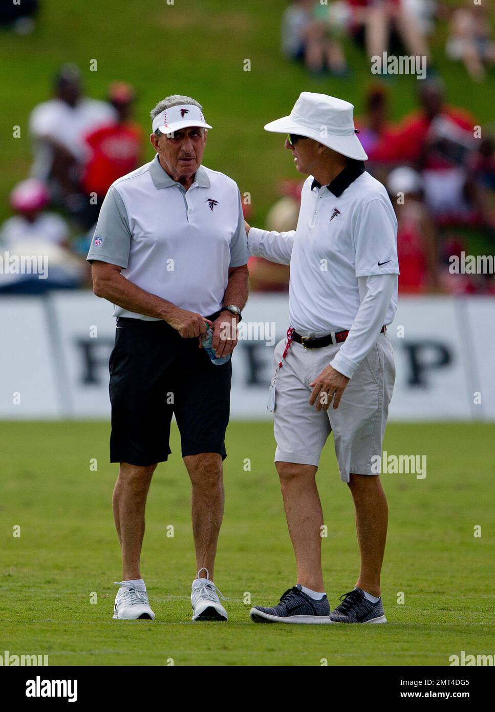 Atlanta Falcons owner Arthur Blank, left talks with president and CEO ...