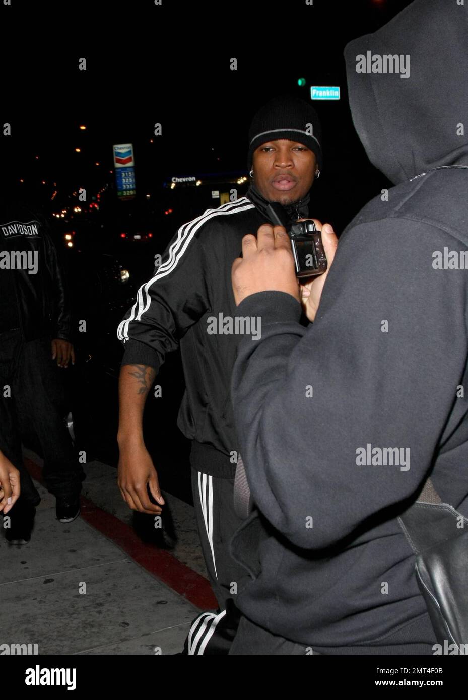 Rapper Ne-Yo and a female friend leave the RedZone Entertainment Pre ...