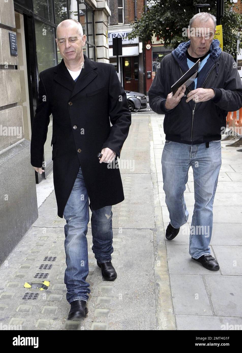 EXCLUSIVE!! The Pet Shop Boys' Neil Tennant looks a bit grumpy as he arrives at BBC Radio 2 ...