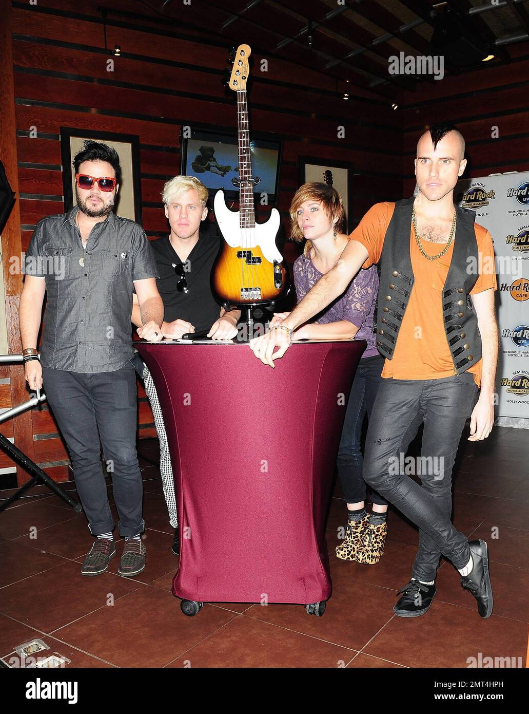 Alternative rock band Neon Trees sign a bass guitar and donate it to ...