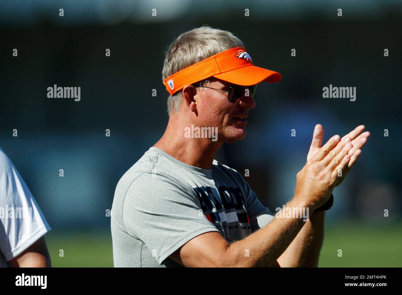 Denver Broncos offensive coordinator Mike McCoy takes part in drills ...