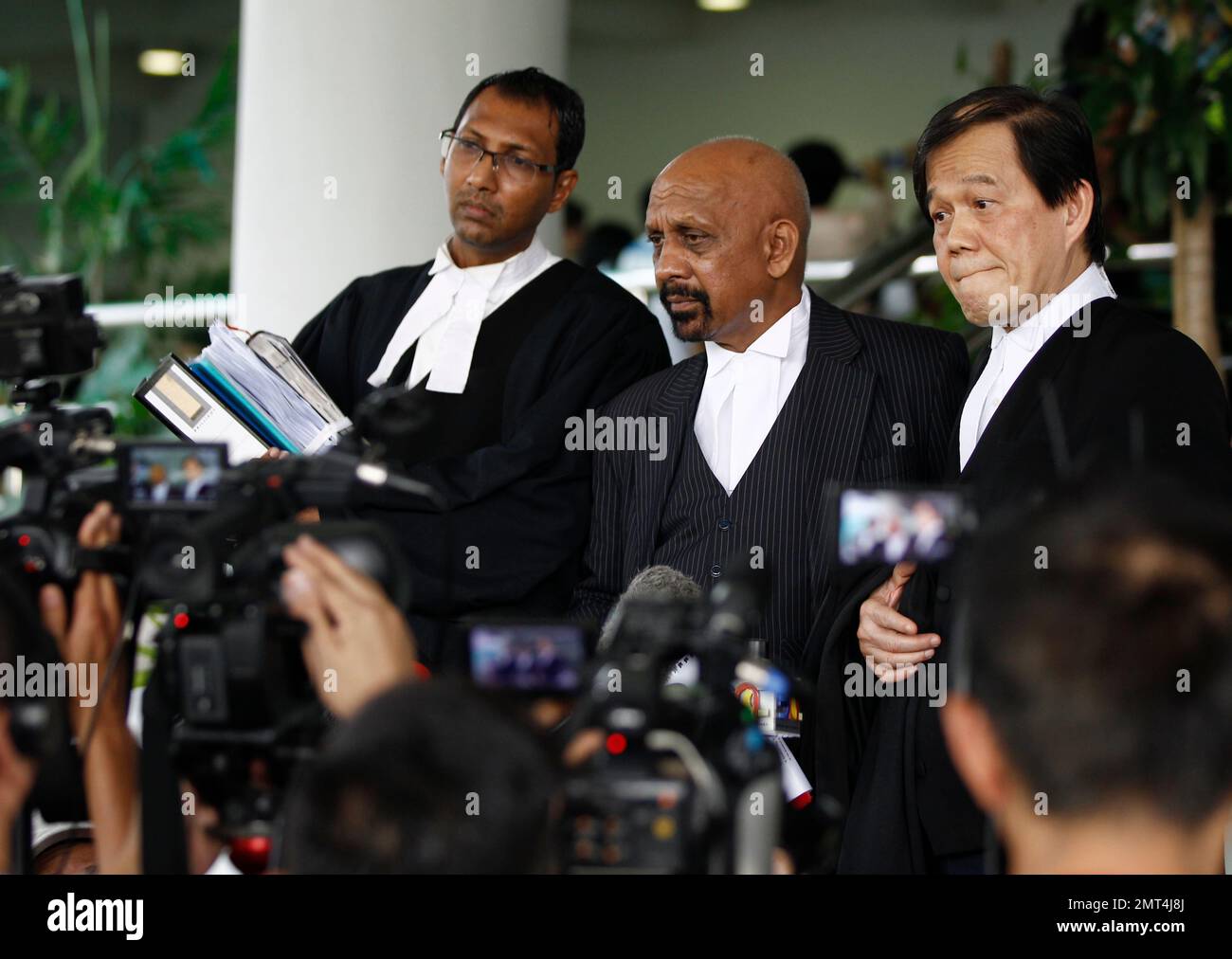Naran Singh, center, and Hisyam Teh Toh Teik, right, lawyers for ...