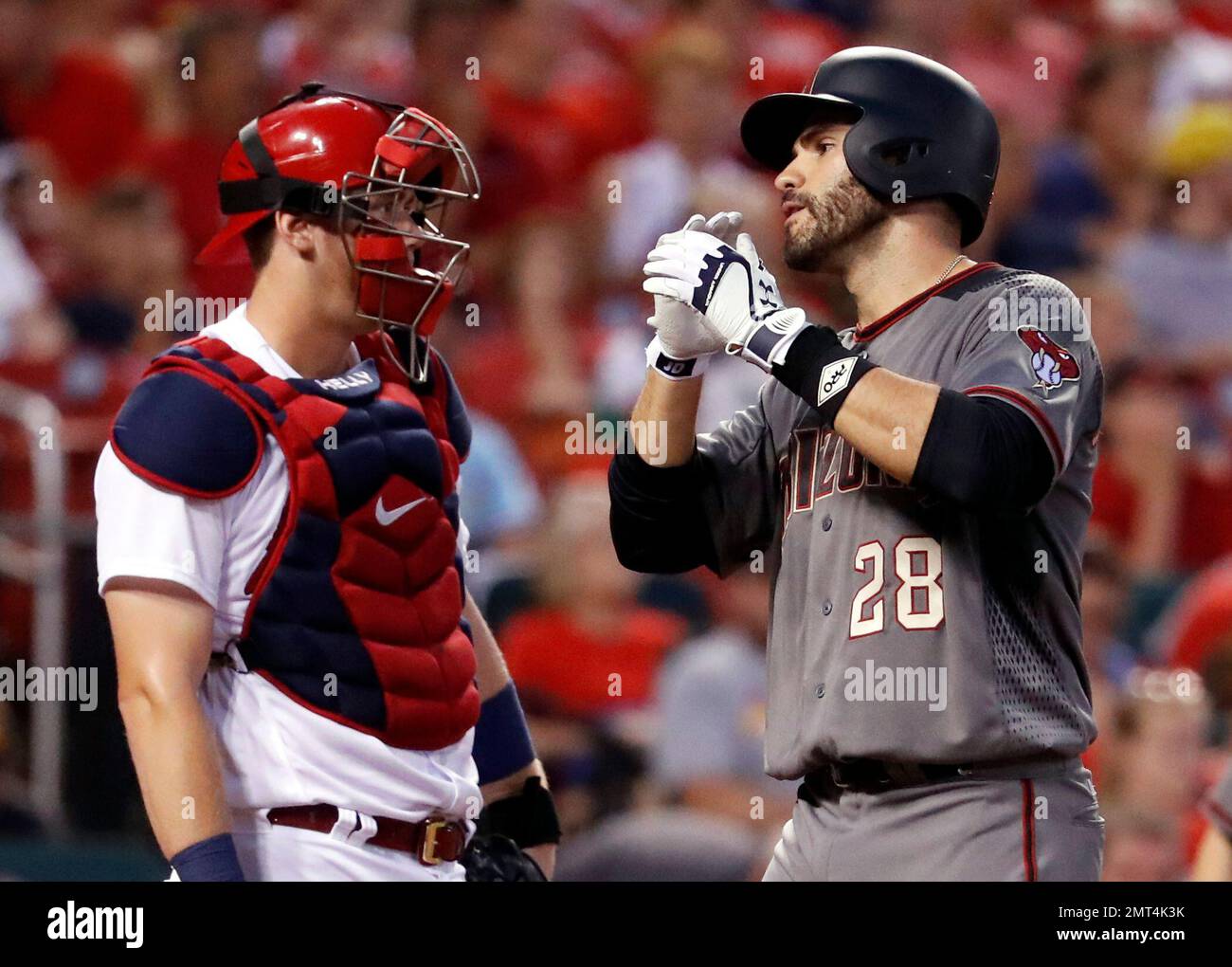 Arizona Diamondbacks' J.D. Martinez, right, applauds after hitting a ...