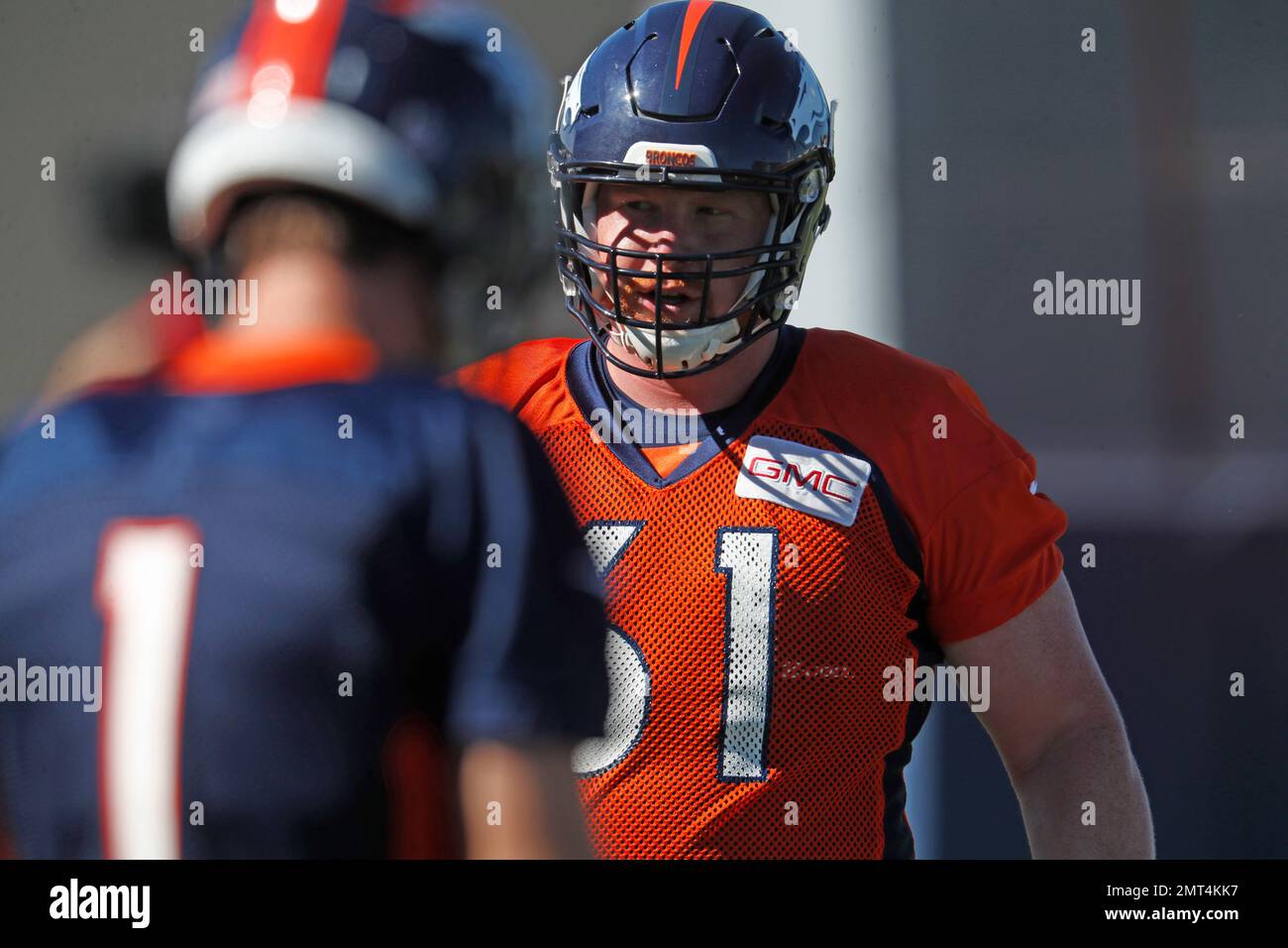 Denver Broncos center Matt Paradis (61) takes part in drills during an ...