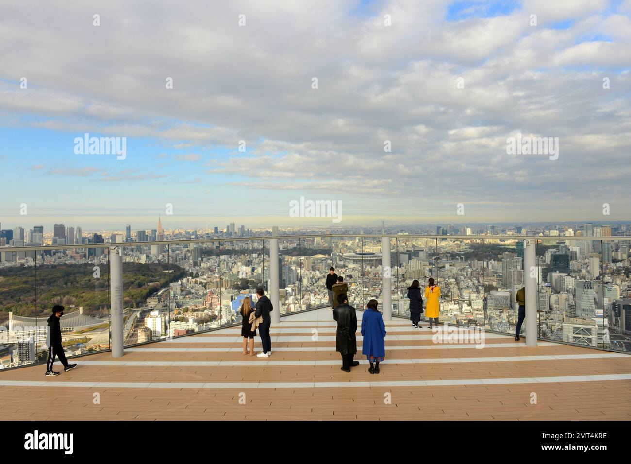 Tourist enjoying the views from the Shibuya Sky rooftop observation ...