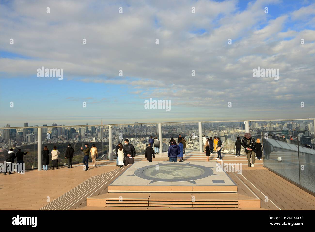 Tourist enjoying the views from the Shibuya Sky rooftop observation ...
