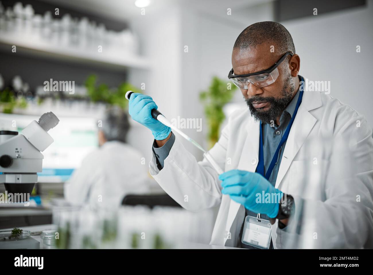 Man, thinking or pipette for test tubes in laboratory, medical science ...
