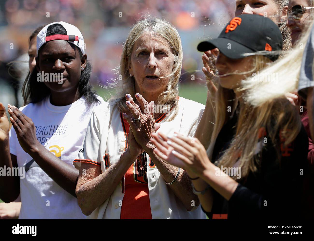 Former Olympic swimmer Anne Cribbs, center, is shown before a baseball ...